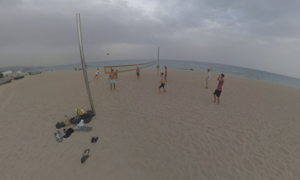 360 VR Barcelona coast with houses, railway and people playing volleyball