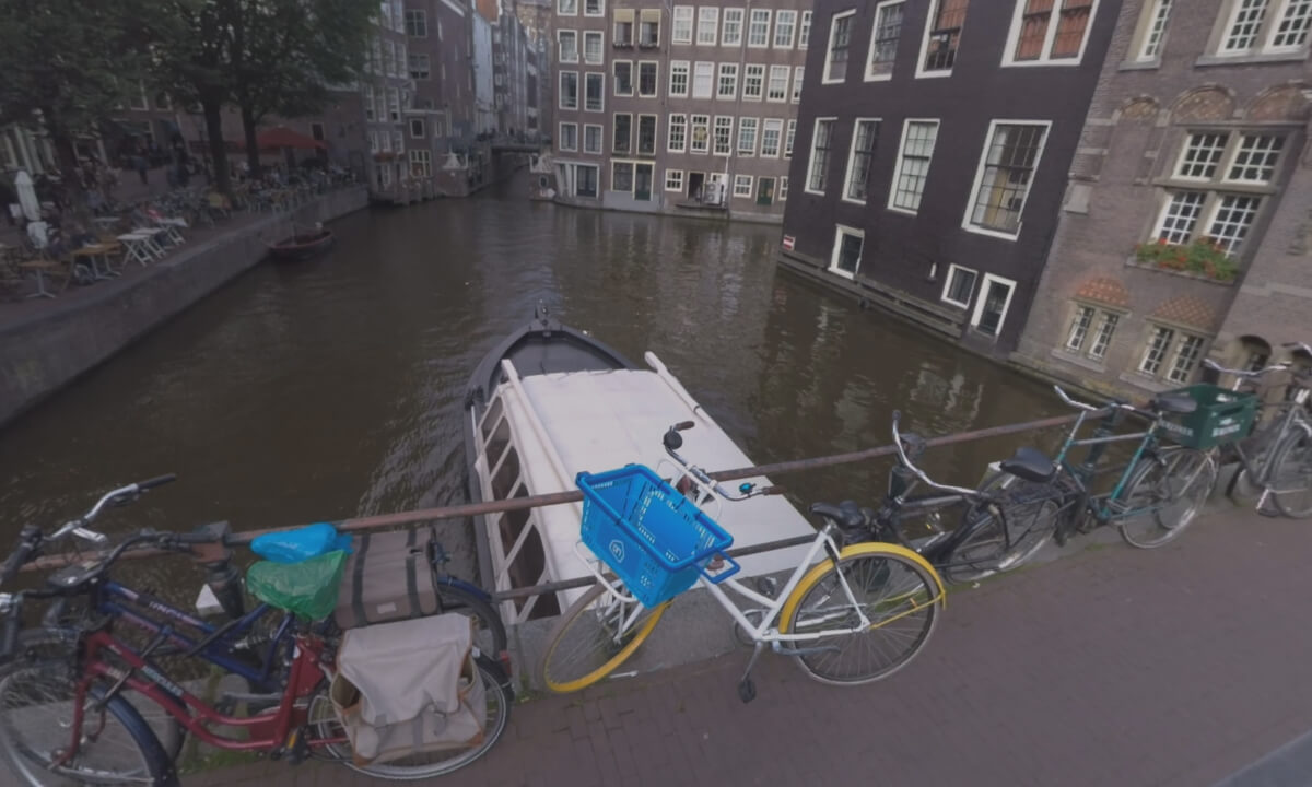 360 VR Amsterdam cityscape with canal, sailing boat and Dutch architecture
