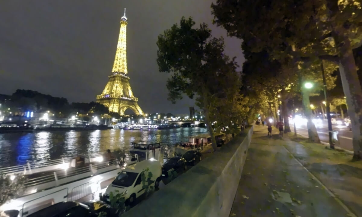 360 VR Paris at night. Scene with Seine, Eiffel Tower and busy street
